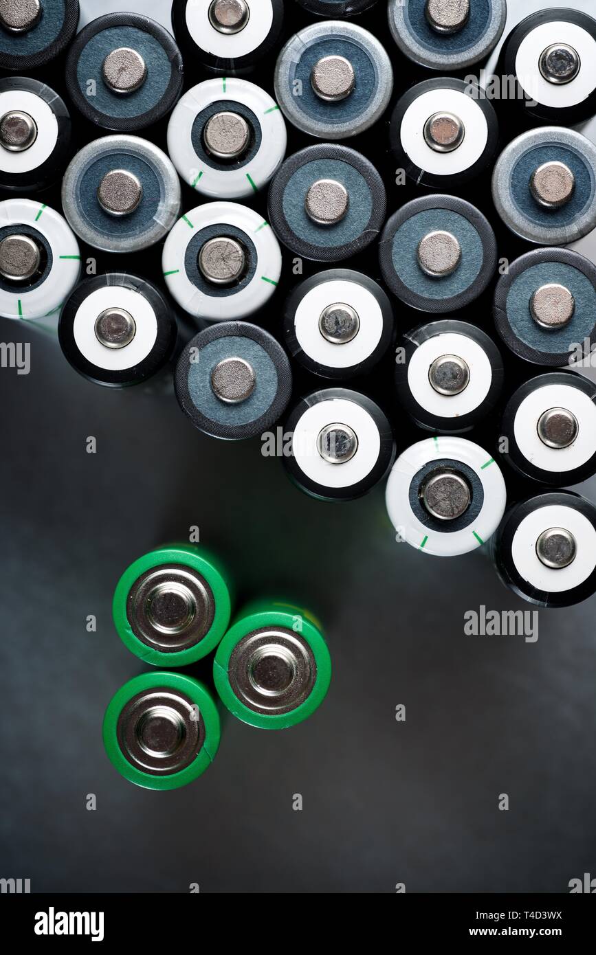 Many batteries on a metal table Stock Photo - Alamy