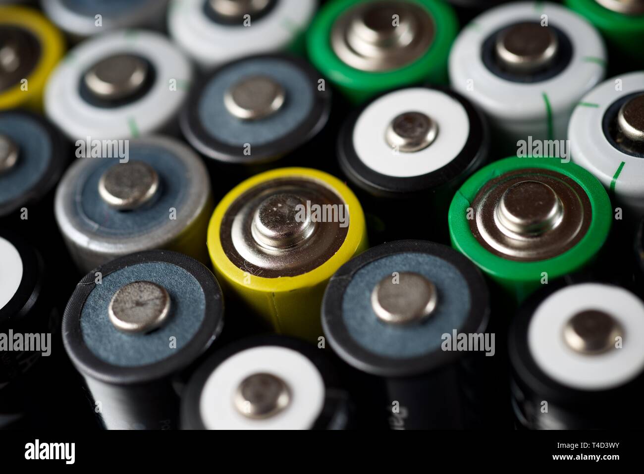 Many batteries on a metal table Stock Photo - Alamy