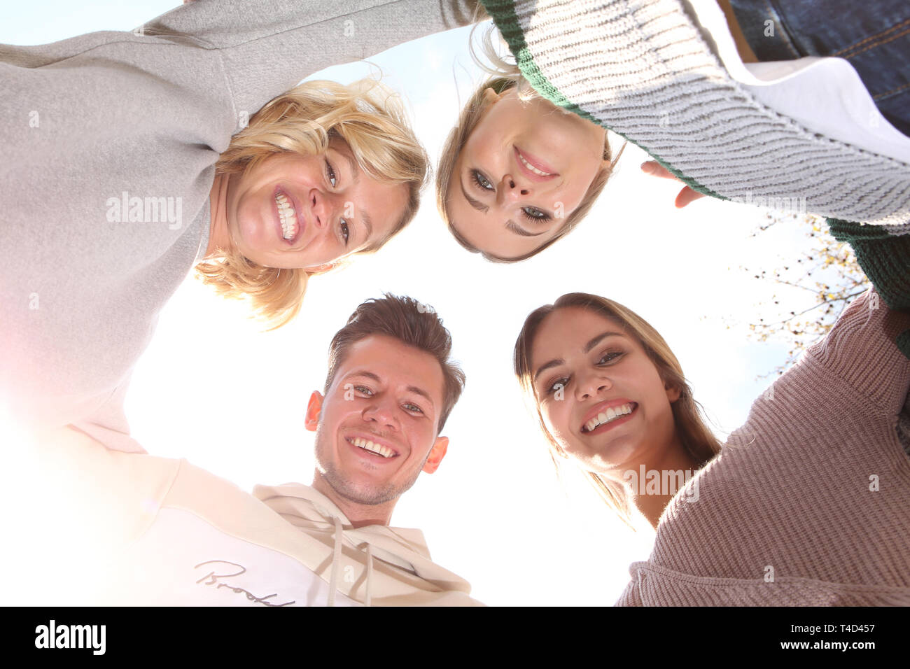 Group of students take a nice picture from below Stock Photo - Alamy