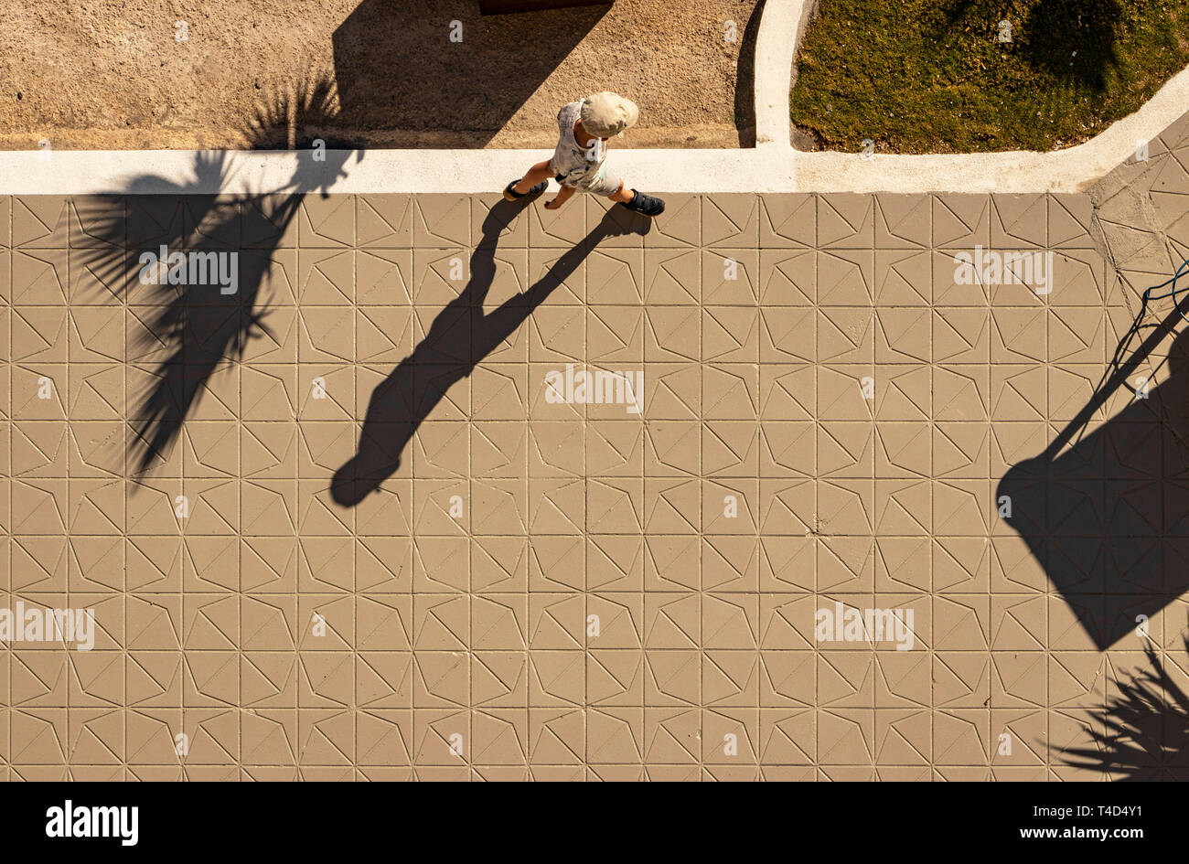 Man walking on paving hi-res stock photography and images - Alamy