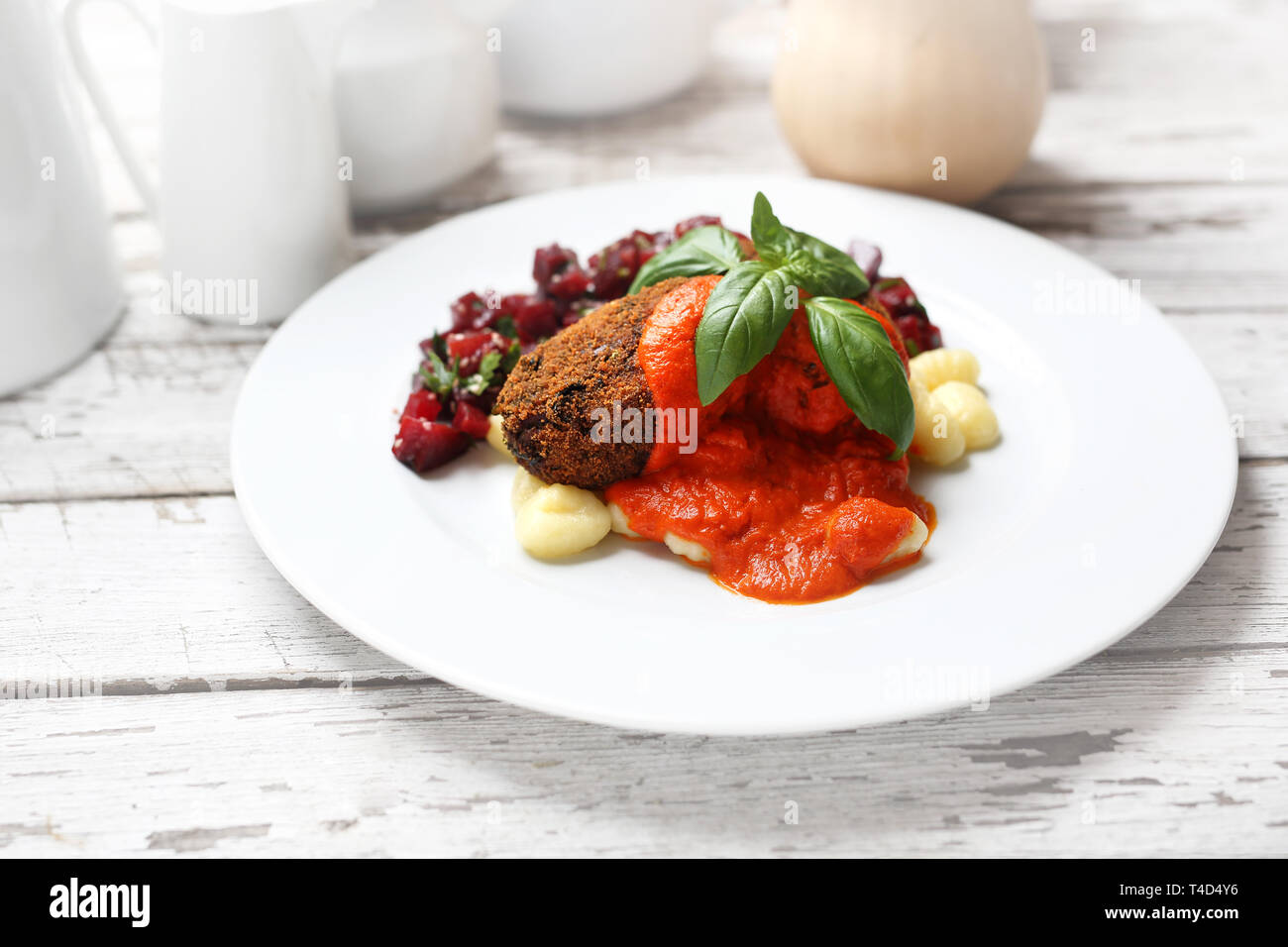 Appetizing dinner dish, vegetarian dish served on a white plate ...