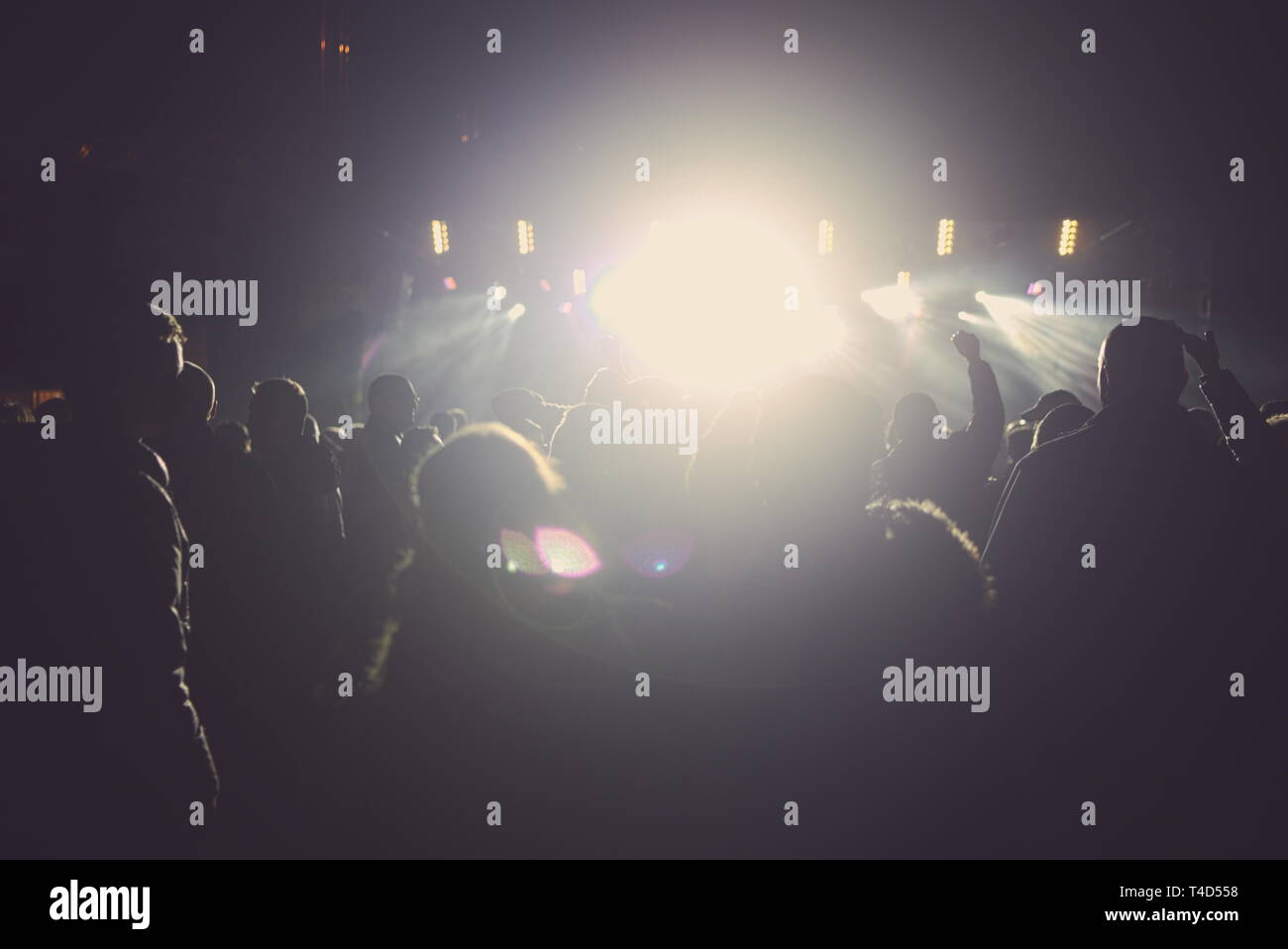 Backlit People at Concert and Strong Spotlights Stock Photo - Alamy