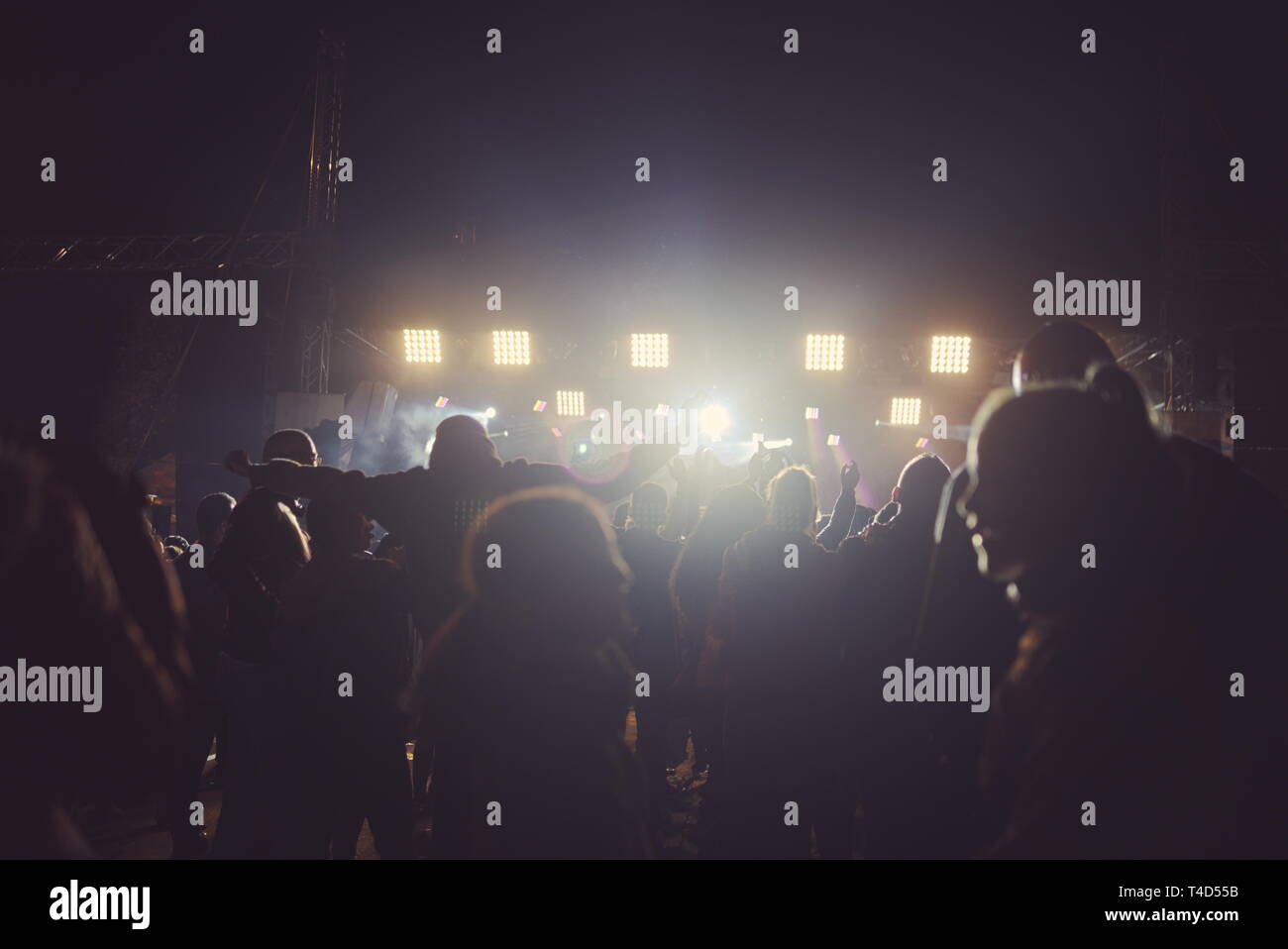 Backlit People at Concert and Strong Spotlights Stock Photo - Alamy