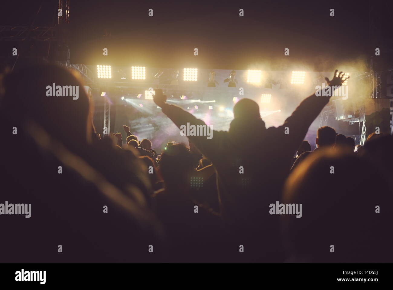 Backlit People at Concert and Strong Spotlights Stock Photo - Alamy