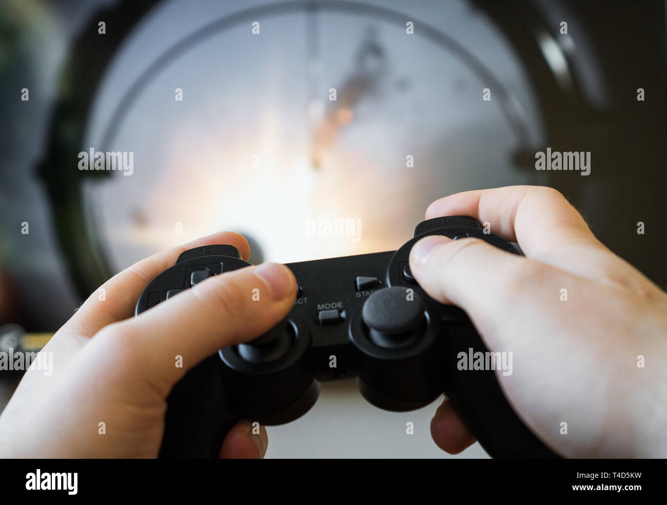 Man playing shooter video game on TV. Gamepad controller in hands Stock ...
