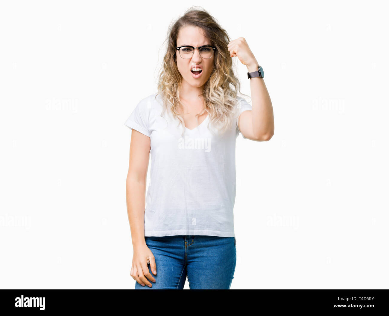 Beautiful young blonde woman wearing glasses over isolated background ...