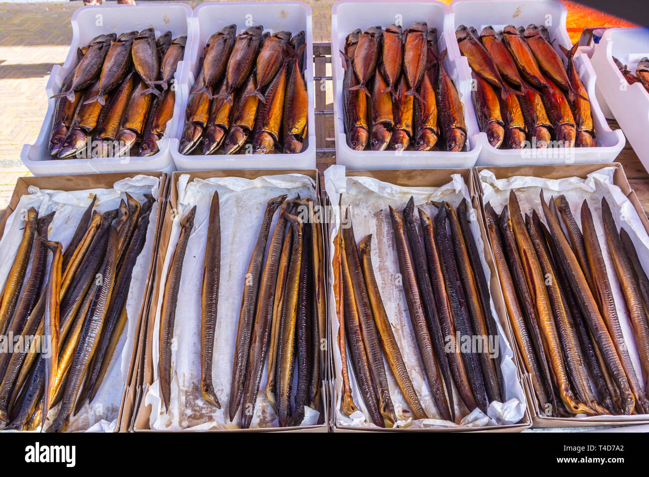 prepared and smoked eels and Atlantic mackerel closeup in local ...