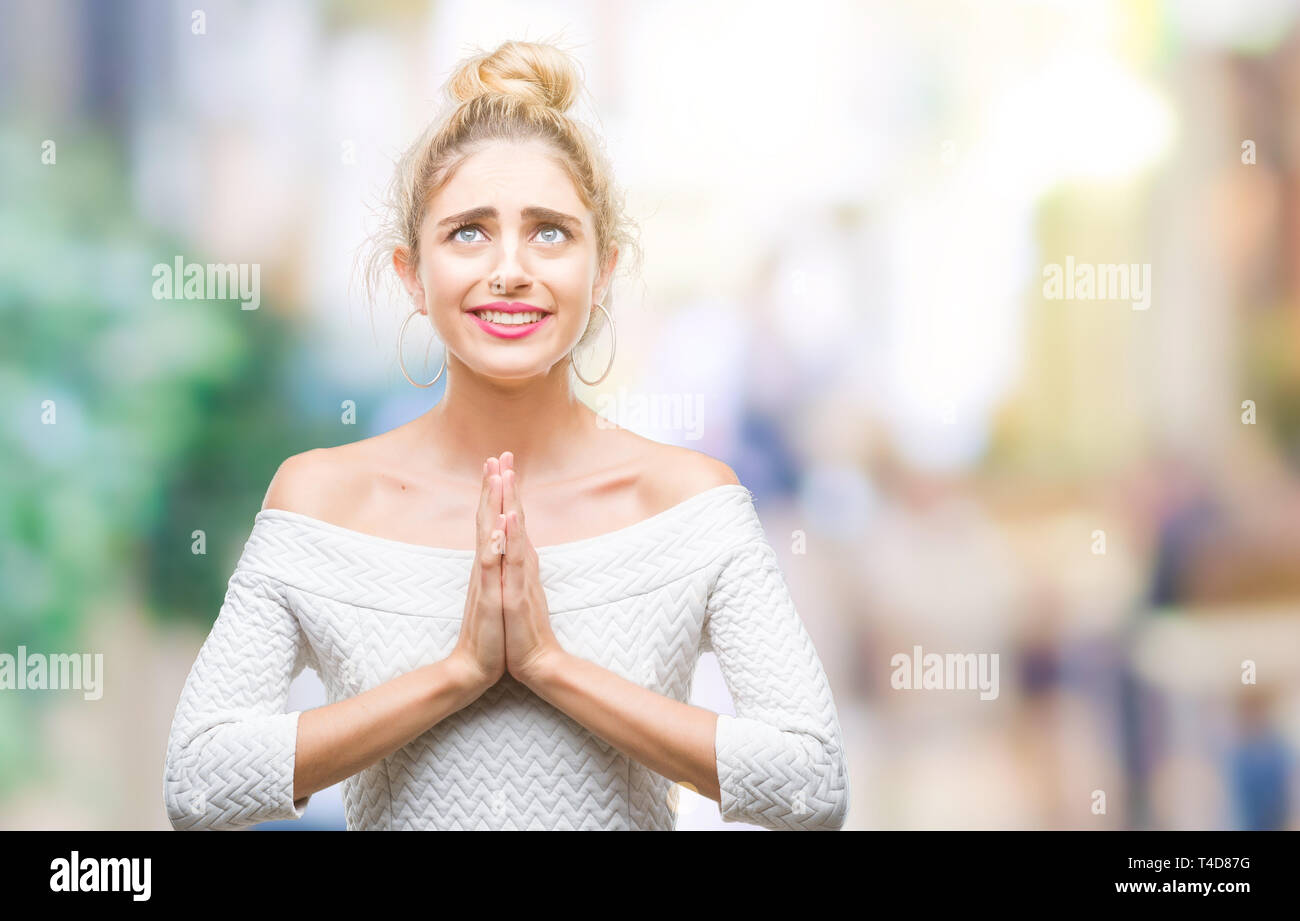Young beautiful blonde and blue eyes woman over isolated background ...