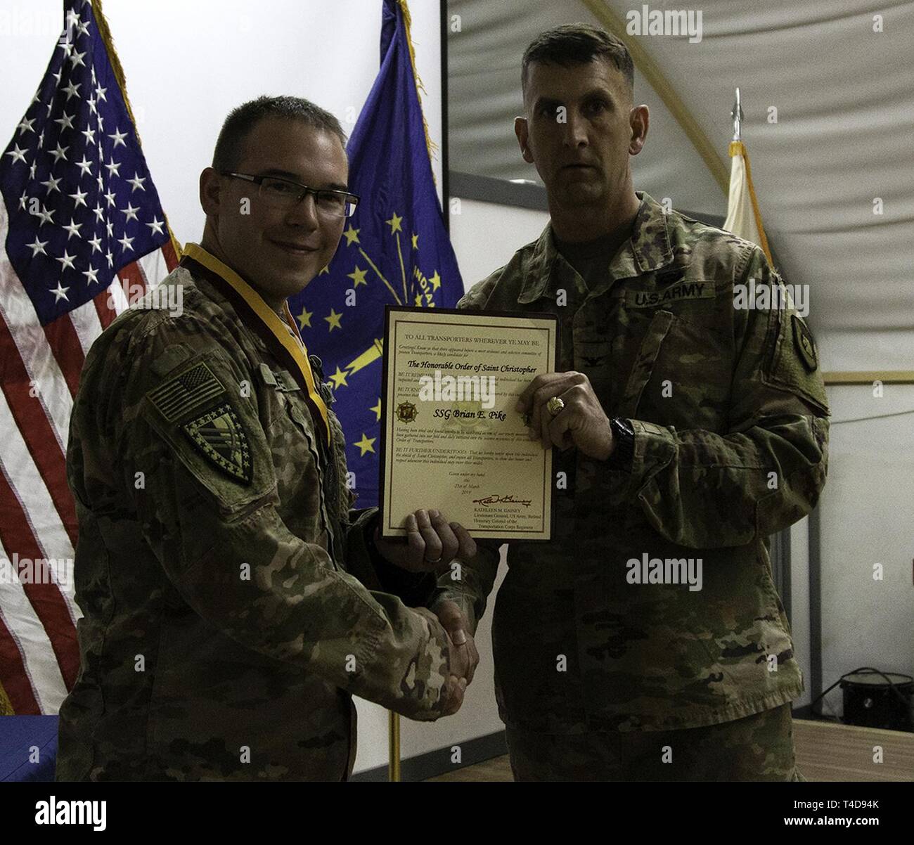 Col. Todd Erskine, 300th Sustainment Brigade commander, presents the ...