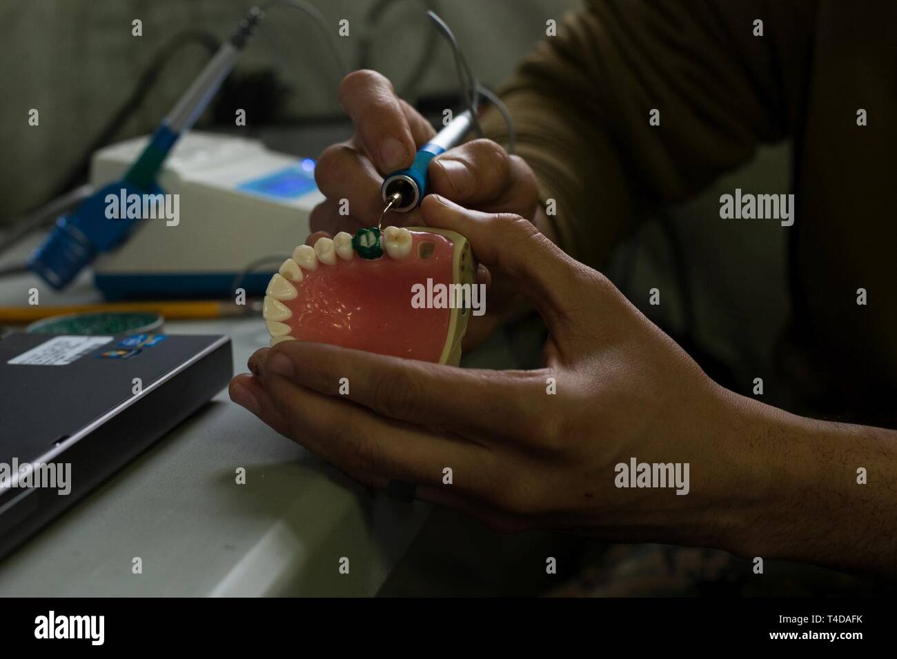 Hospital Corpsman 3rd Class Thomas Wesley, a dental lab technician with ...
