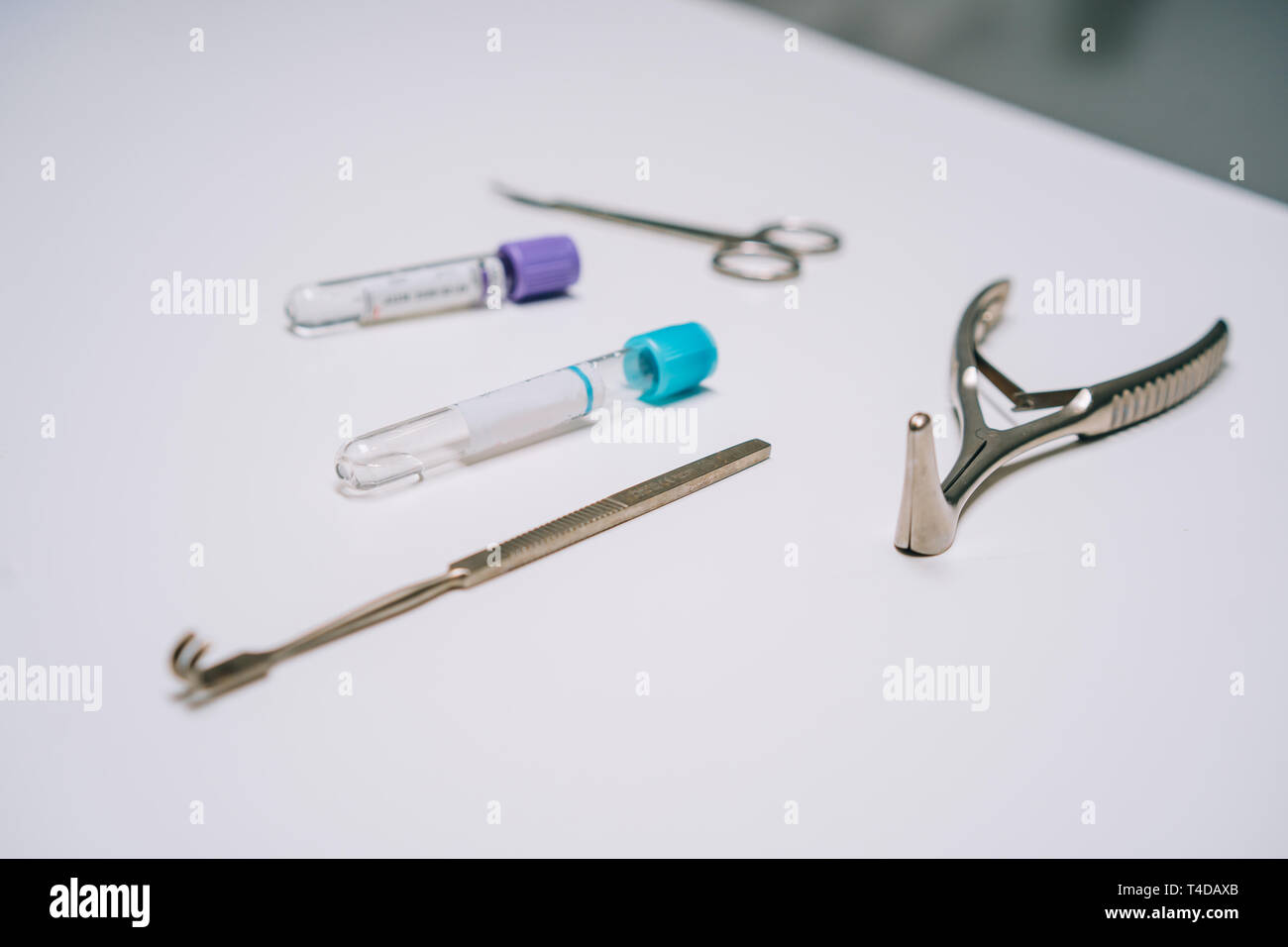 surgical instruments and several test tubes lie on the table Stock ...