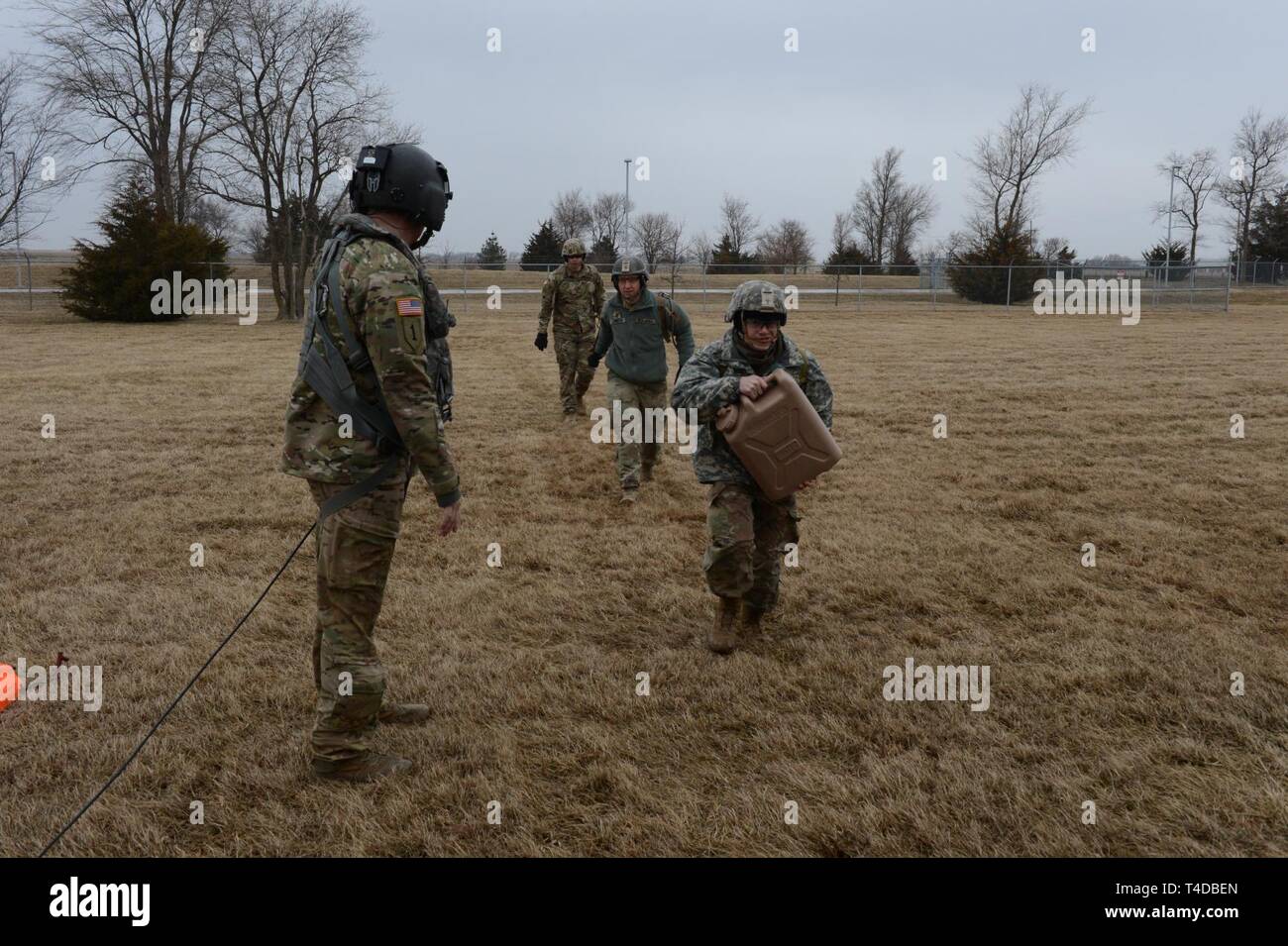 Nebraska National Guard Soldiers hustle to board the UH-60 Blackhawk ...
