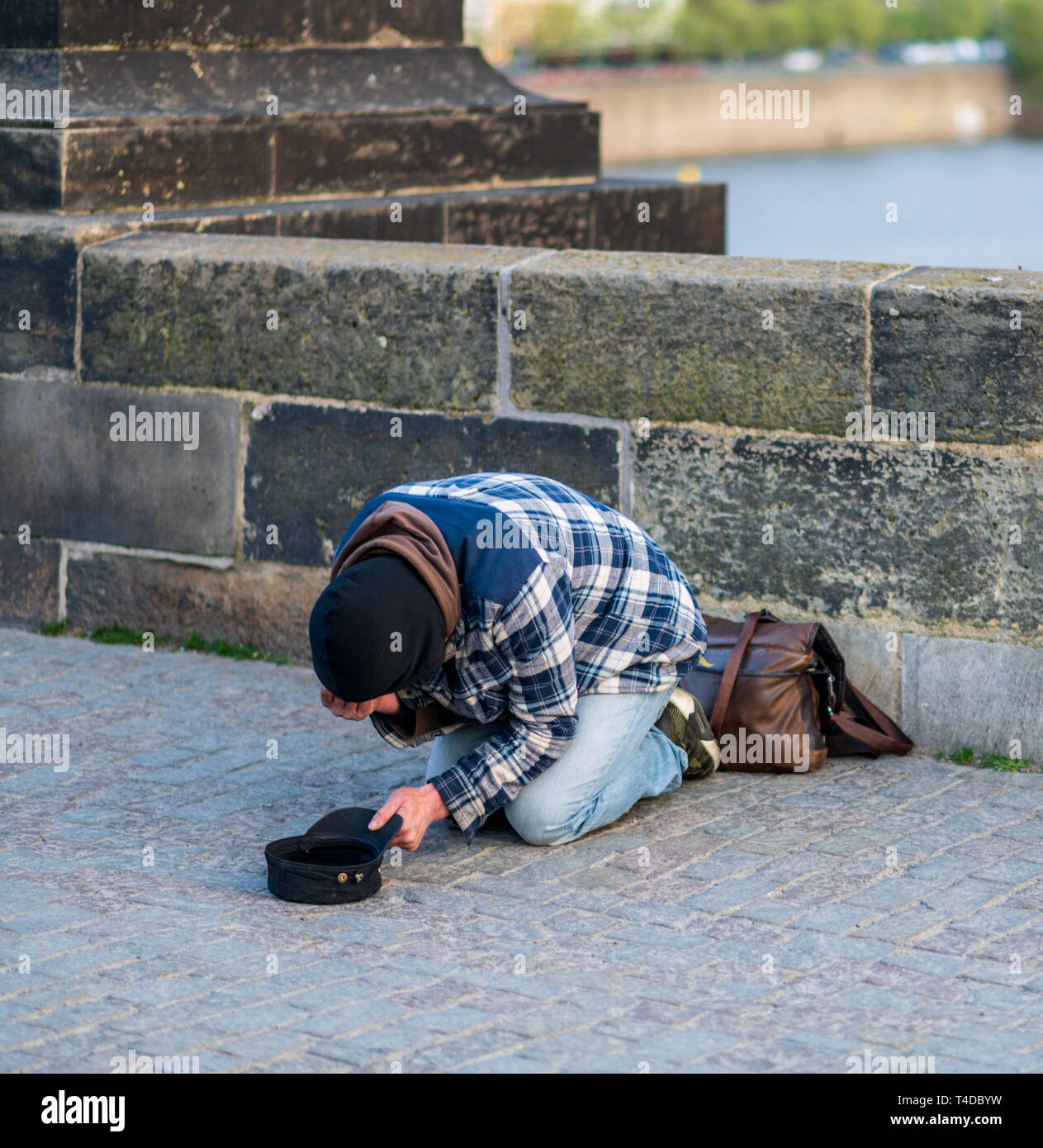 Man on knees begging in hi-res stock photography and images - Alamy
