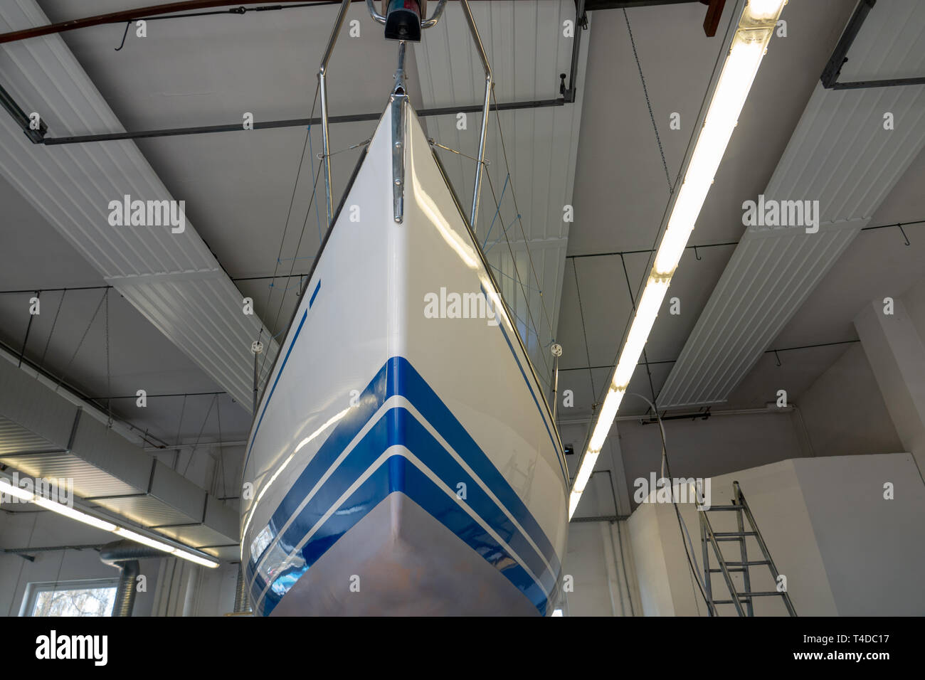 a sailing ship stands in a paint shop to be repainted Stock Photo - Alamy