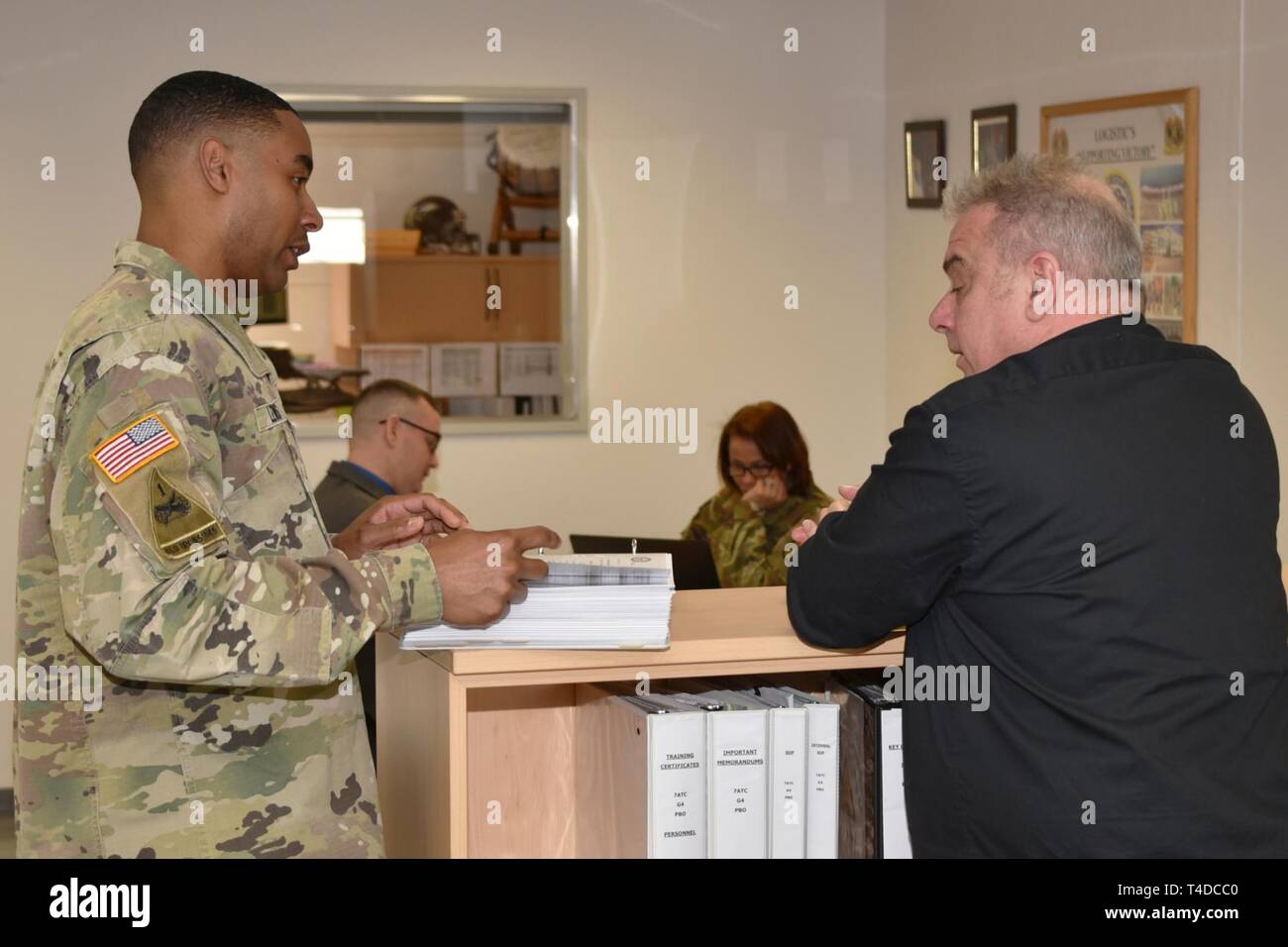 U.S. Army Chief Warrant Officer 3 Quince N. Lewis, left, with the U.S ...