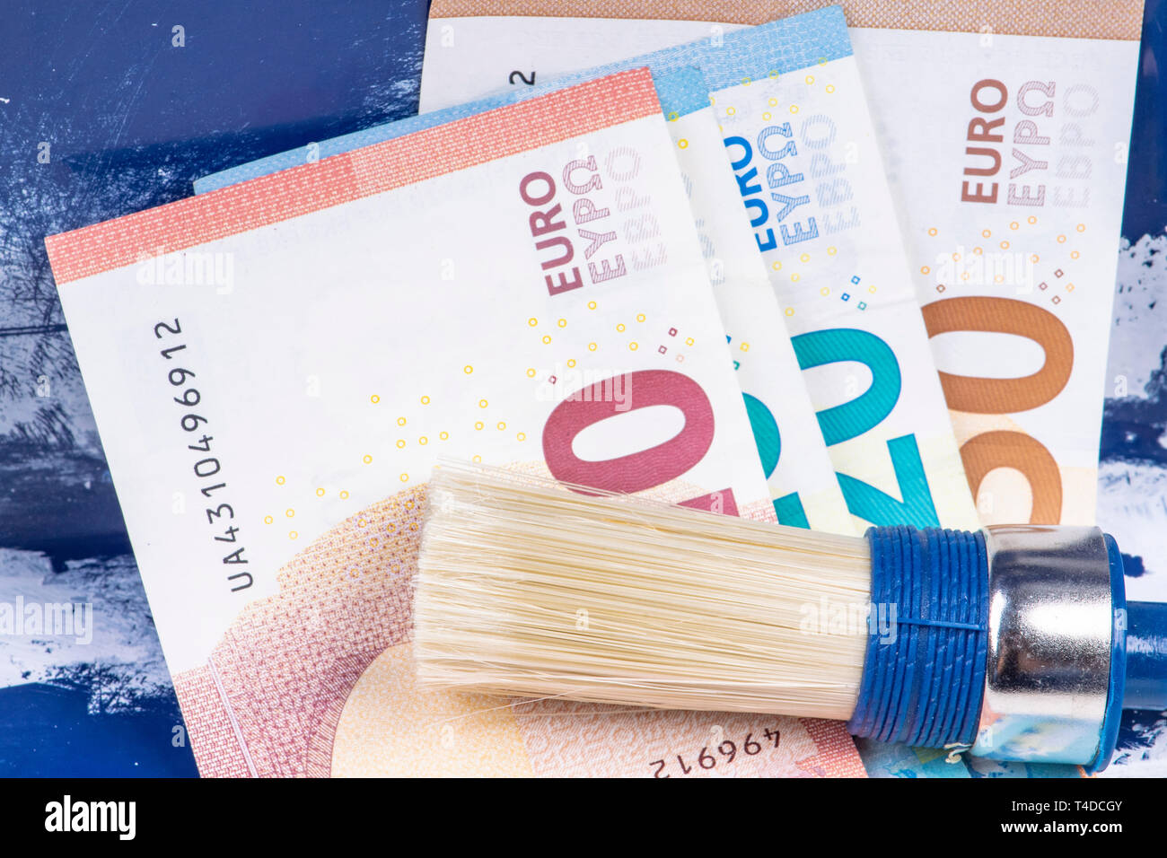 blue background with euro money and paintbrush Stock Photo - Alamy
