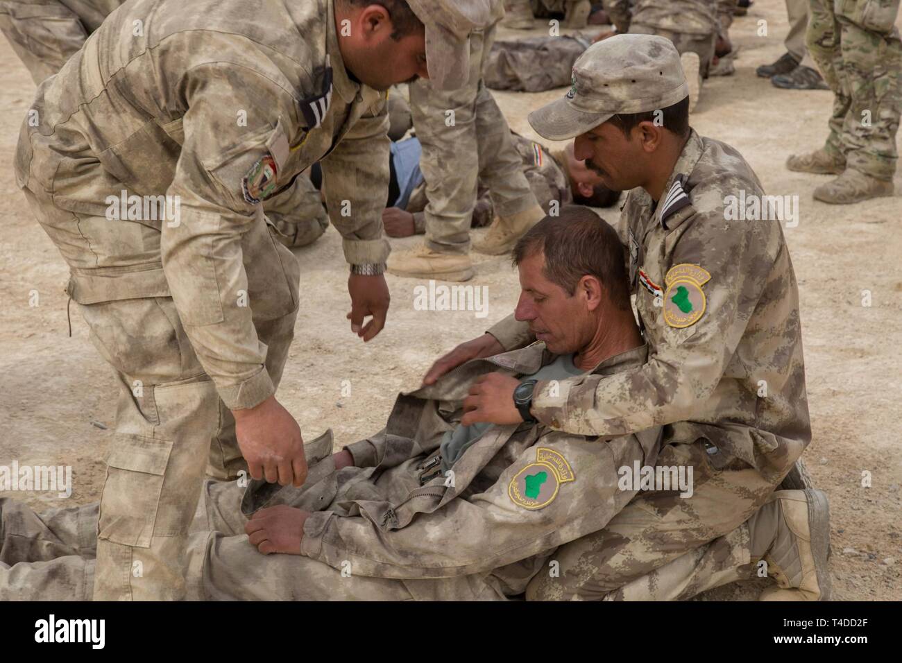 Iraqi soldiers learned how to look for wounds in the event they perform ...