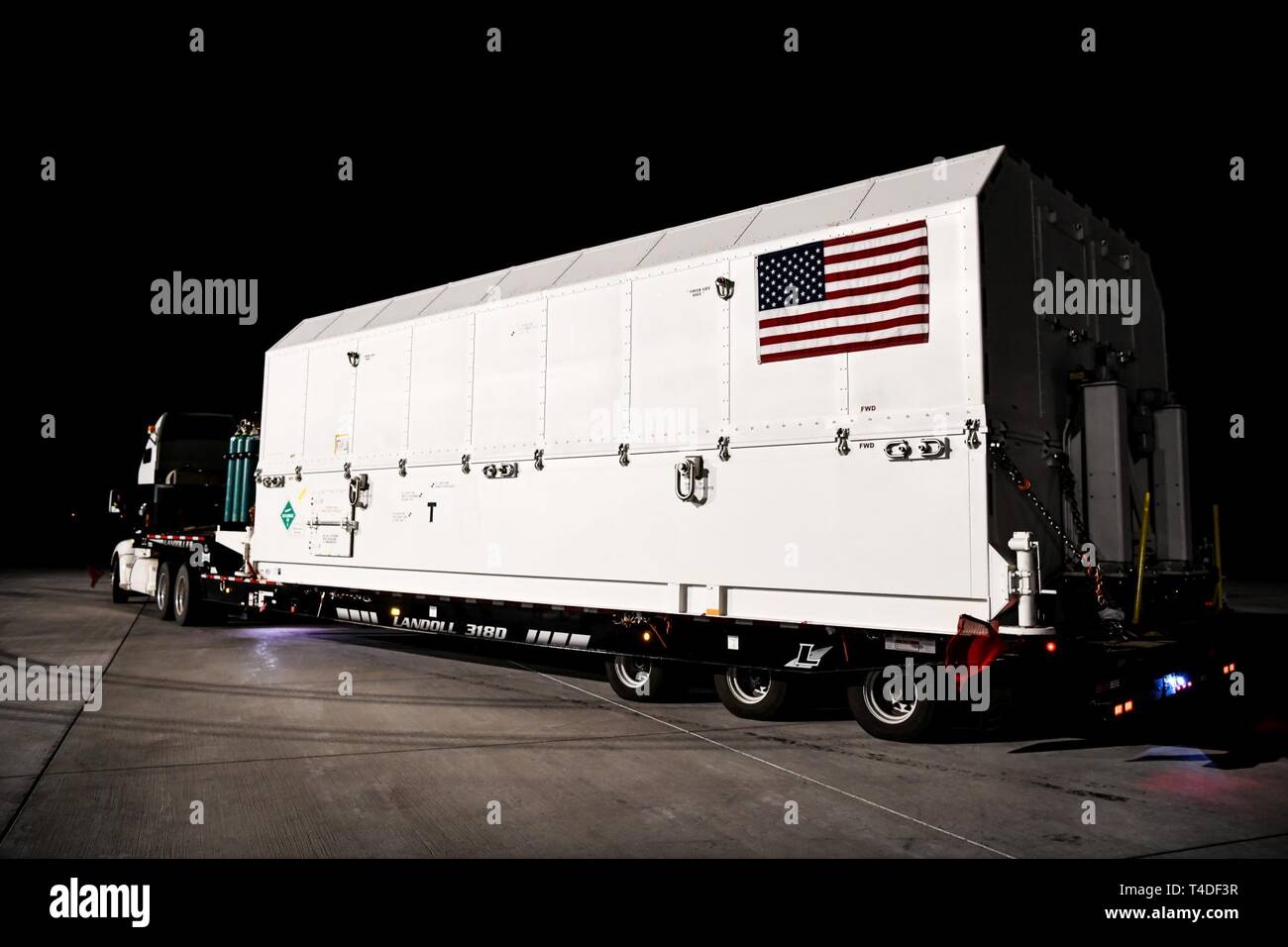 A satellite is loaded onto a C-17 Globemaster III March 19, 2019, on ...