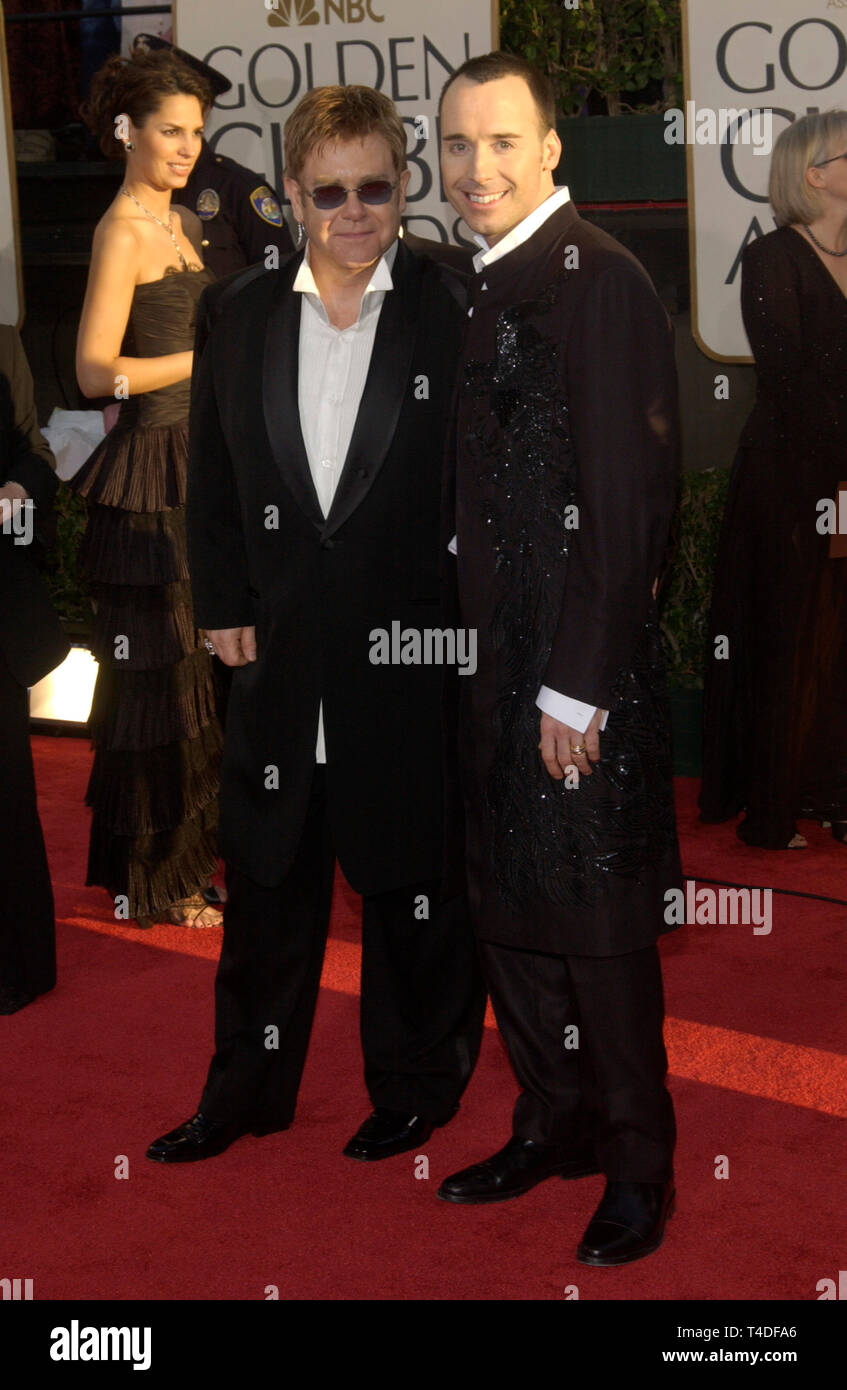 LOS ANGELES, CA. January 25, 2004: SIR ELTON JOHN (left) & partner ...