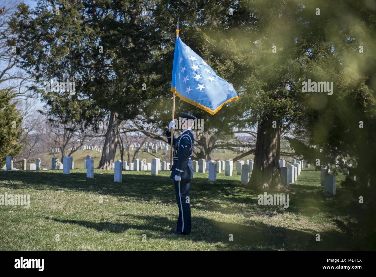 A Personal Color Bearer of the U.S. Air Force Honor Guard carries the ...