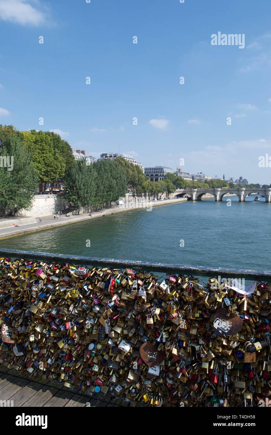Padlocks (love locks) on railing of bridge over River Seine in Paris ...