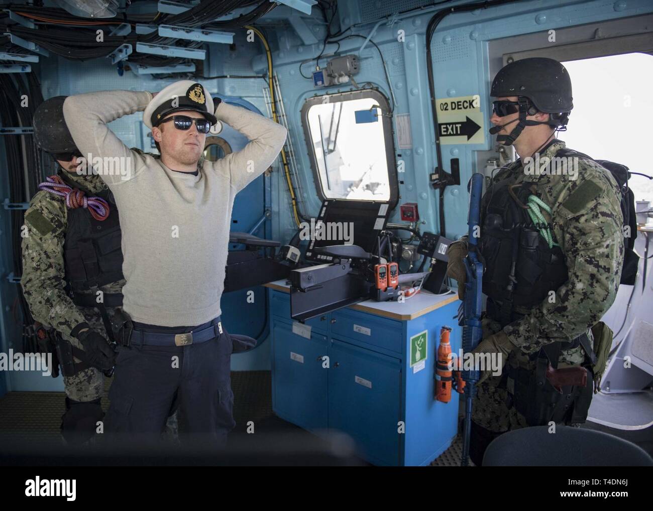 OCEAN (April 2, 2019) - Fire Controlman 2nd Class Nathan Medich, left ...