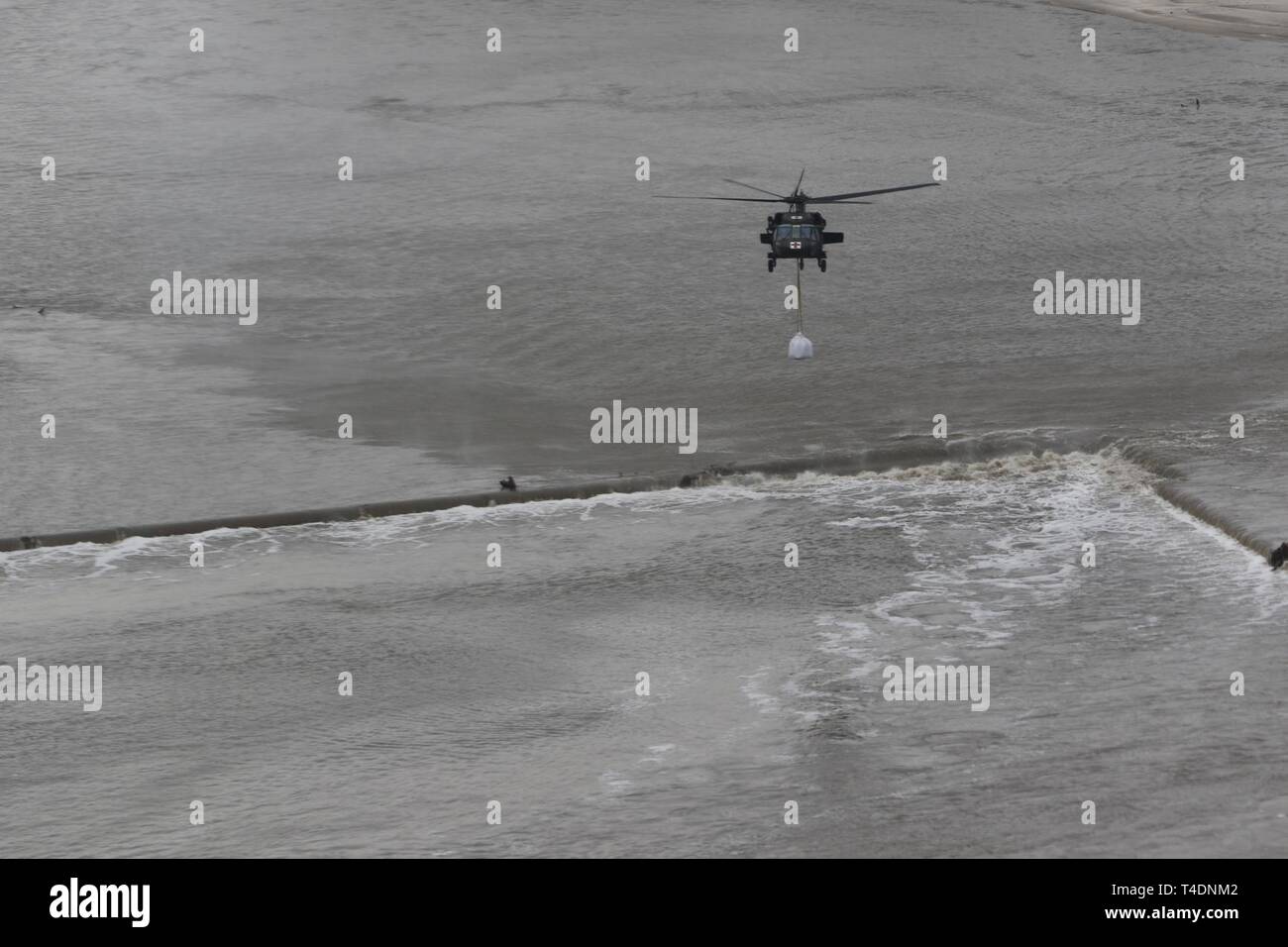 A Nebraska Army National Guard UH-60 Blackhawk helicopter crew delivers ...