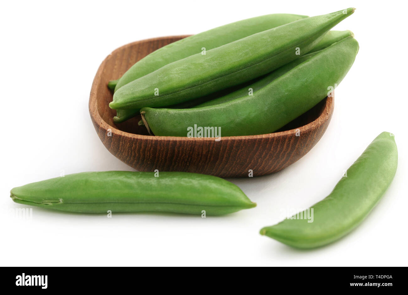 Whole green peas in a bowl over white background Stock Photo - Alamy
