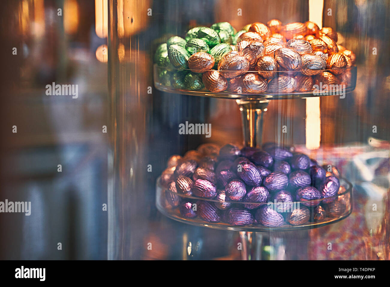 Traditional colorful Easter chocolate eggs in a confectionery ...