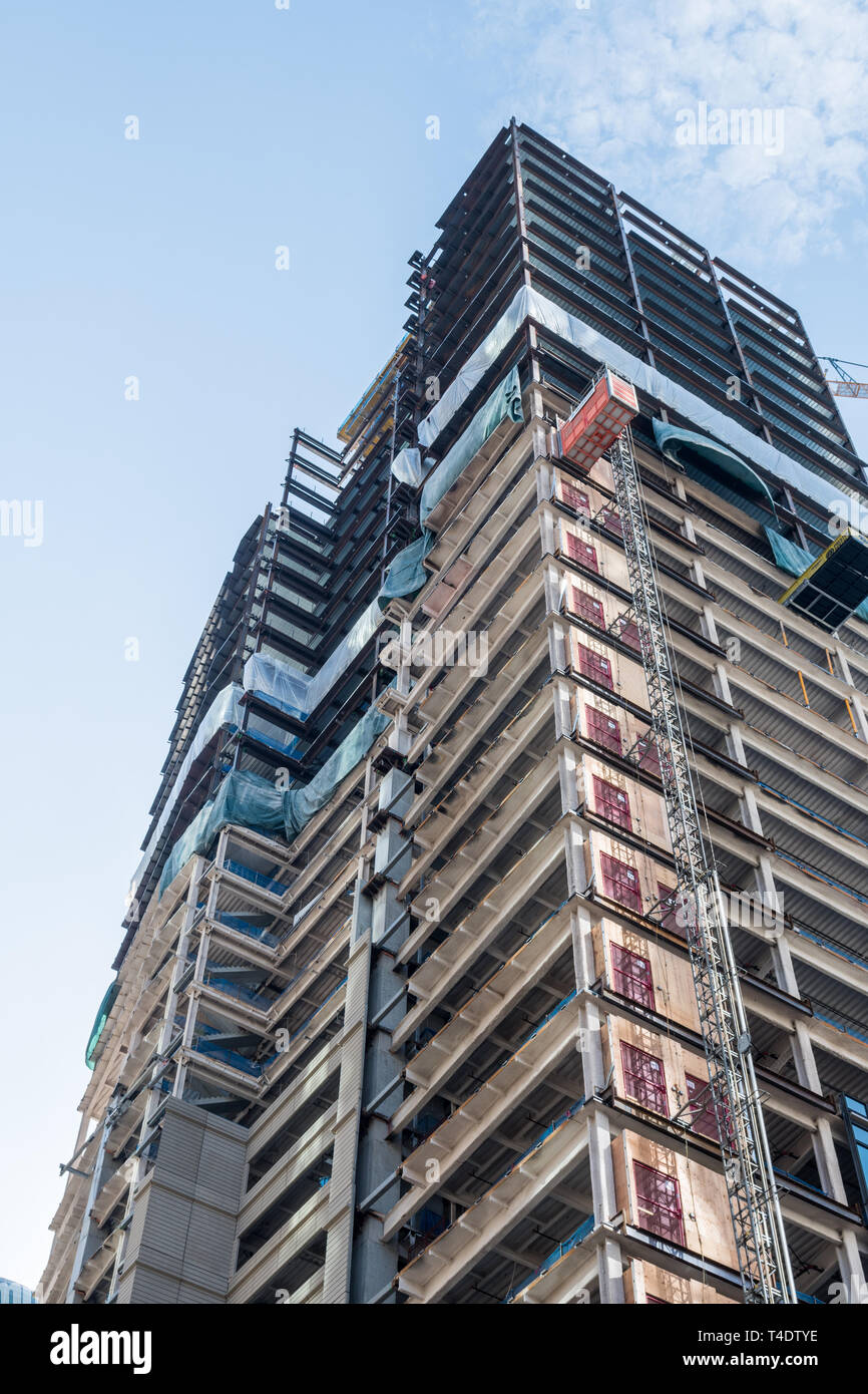 Bottom view of an under construction skyscraper in Seattle on a clear ...