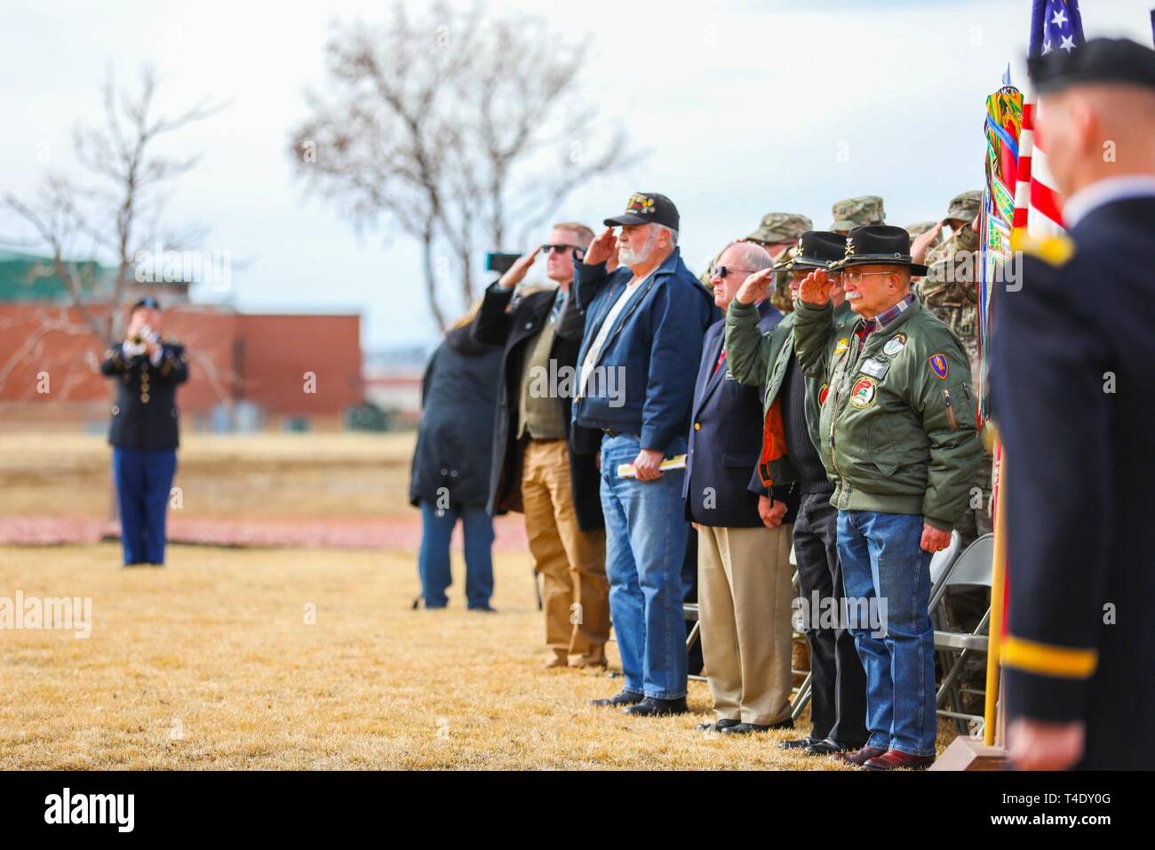 Veterans of the Battle of Suoi Tre salute during a memorial and ...