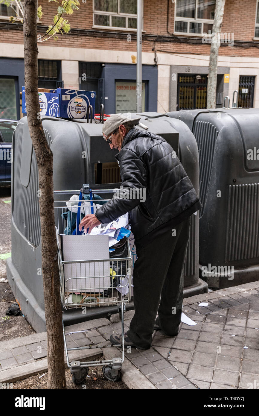 Man going through bins hi-res stock photography and images - Alamy