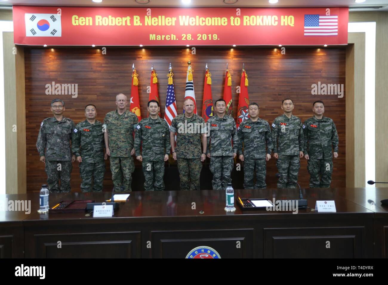 Commandant of the Marine Corps Gen. Robert B. Neller, center, poses for ...