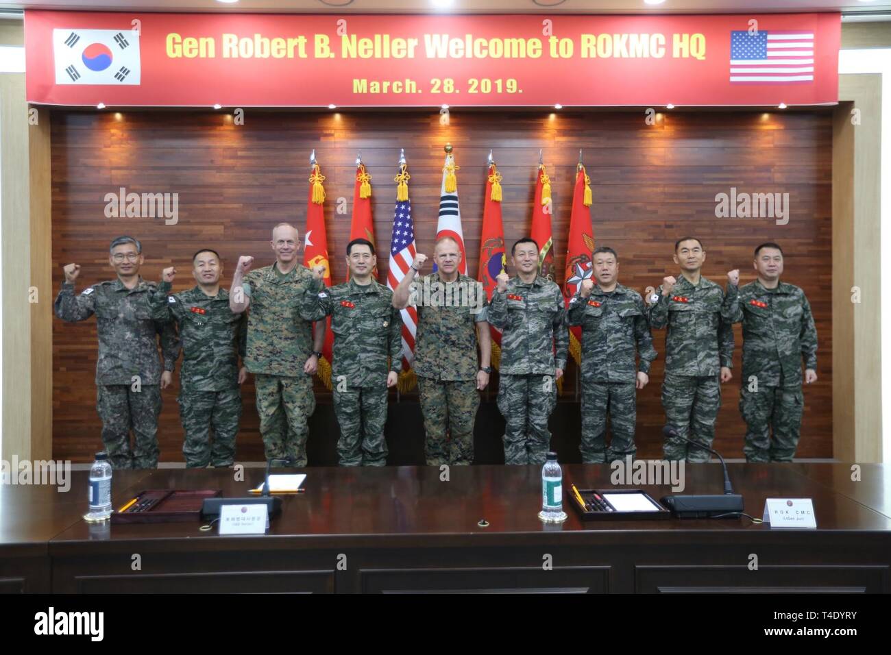 Commandant of the Marine Corps Gen. Robert B. Neller, center, poses for ...