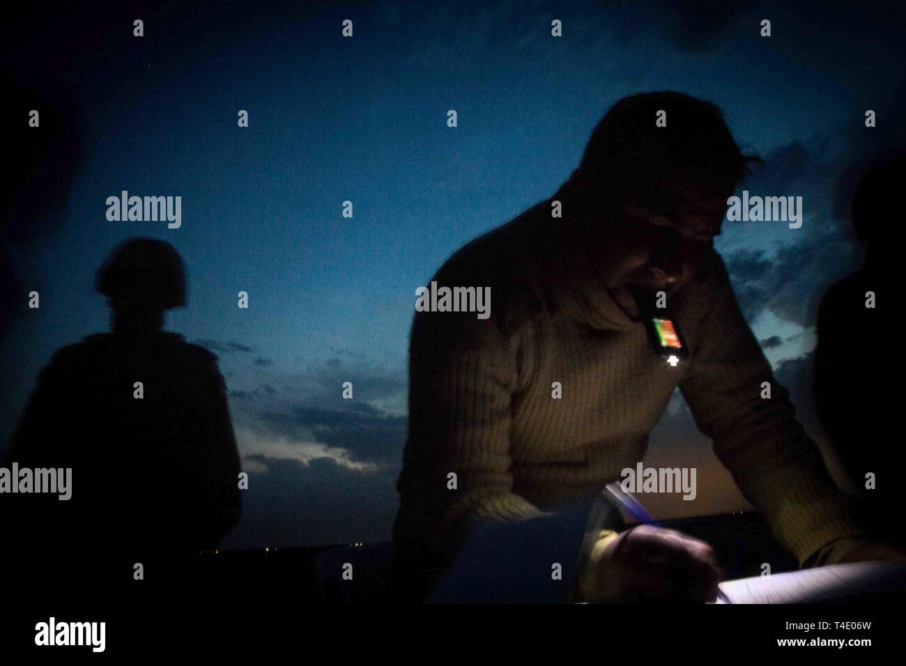 Iraqi soldiers plot coordinates on a map to determine where to adjust ...