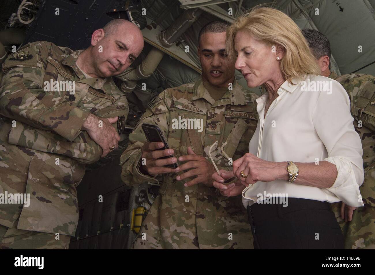 Staff Sgt. Anthony Miller, center, 746th Expeditionary Airlift Squadron ...