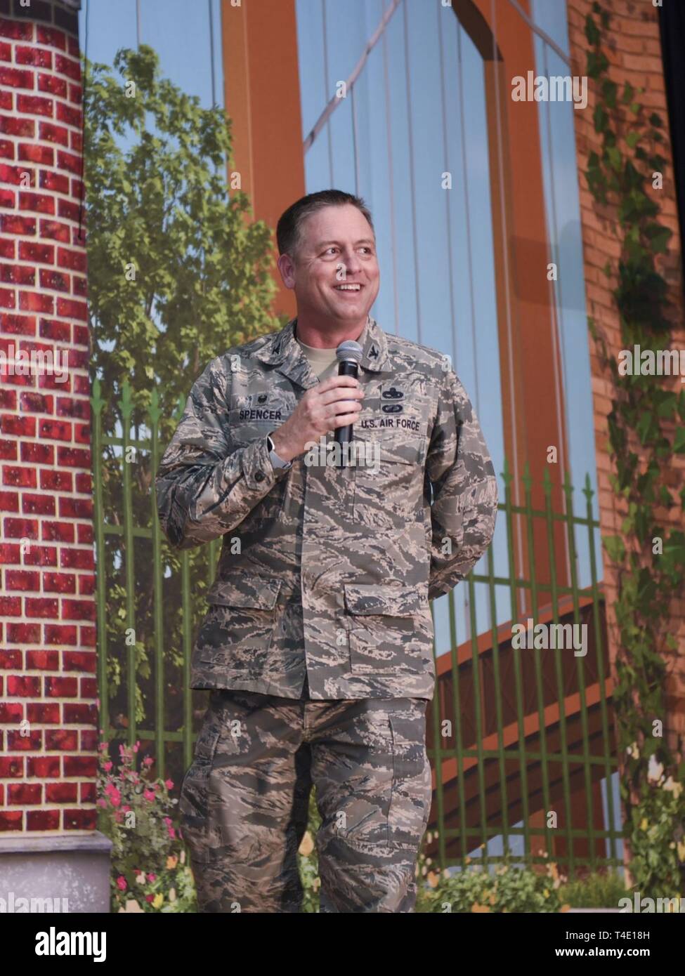 Colonel Benjamin Spencer, 319th Air Base Wing commander, interacts with ...