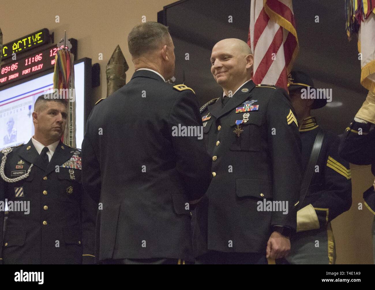 Former Sgt. Robert K. Debolt III, 1st Infantry Division, recieves the ...