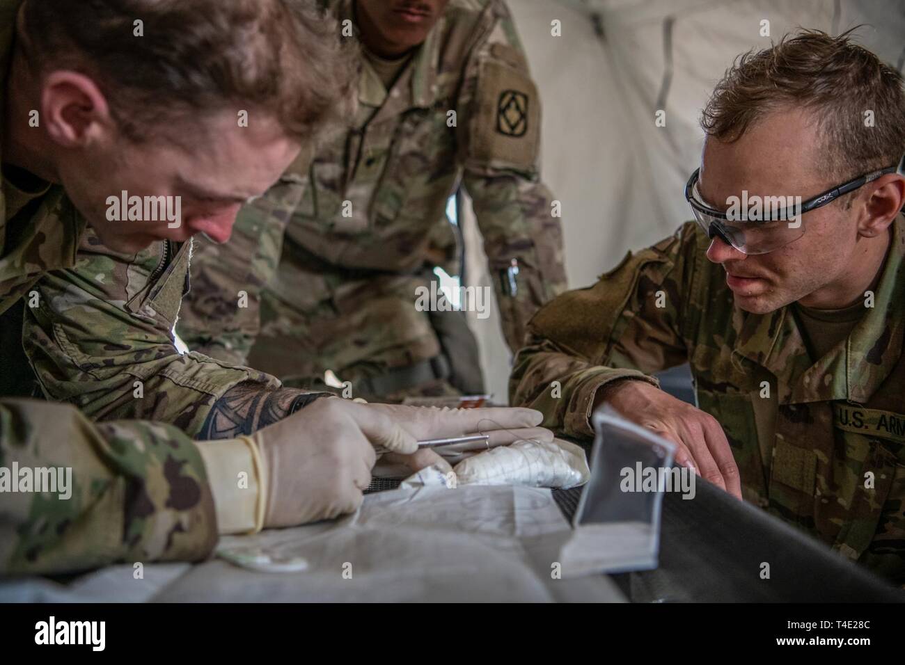 Pvt. Cody Tharp, (right), a combat medic assigned to 2nd Battalion ...
