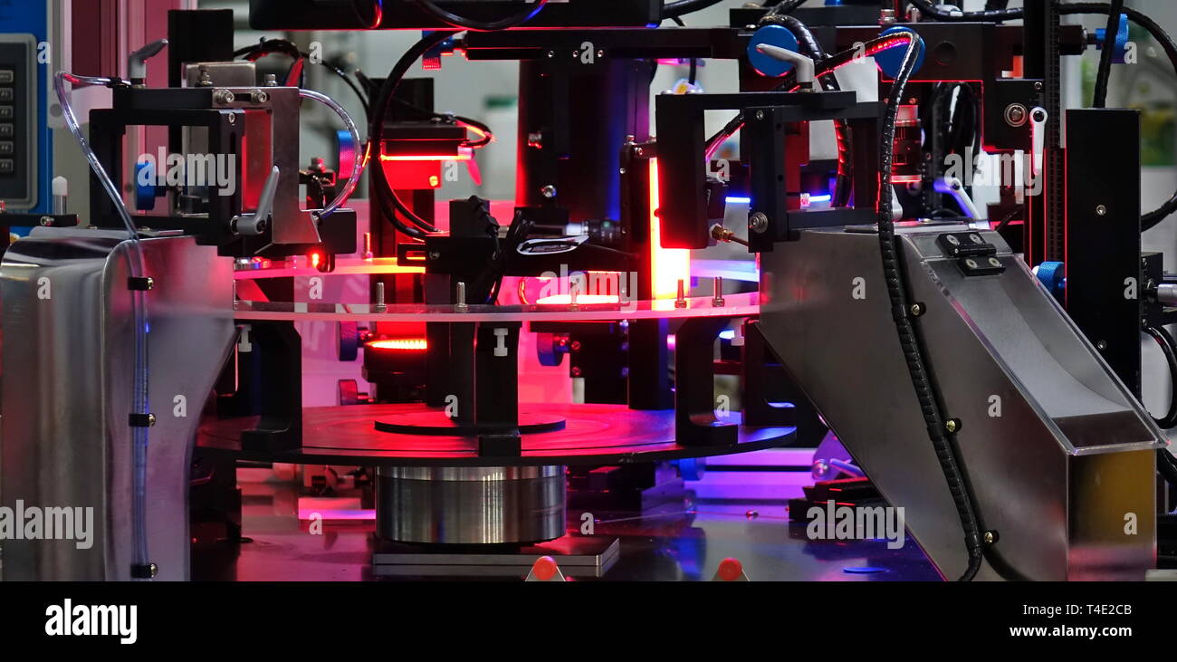 A complex automated precision component machine Stock Photo - Alamy