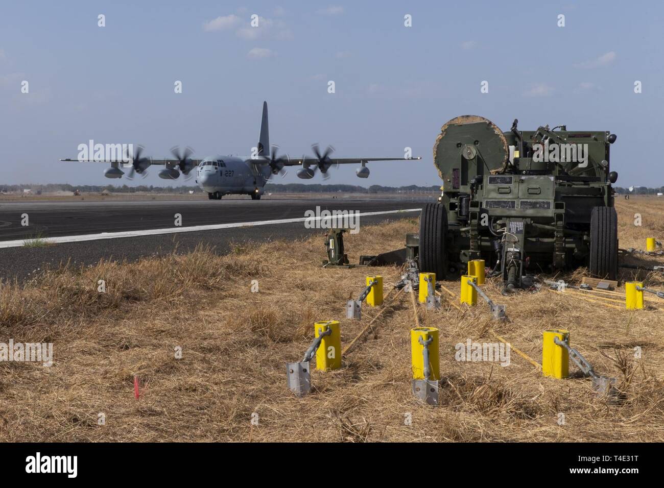 A U.S. Marine Corps KC-130J Super Hercules with Marine Refueler ...