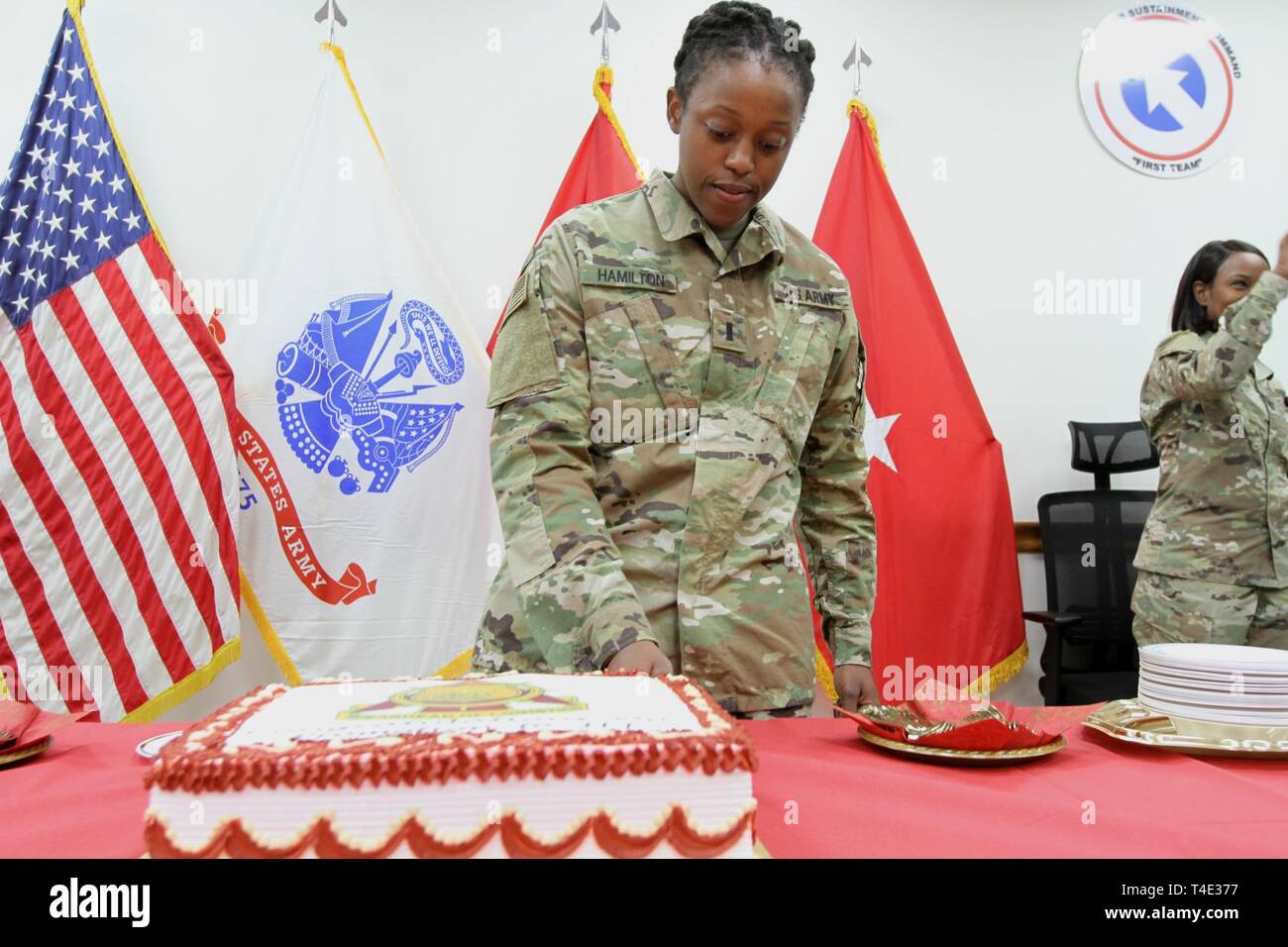 1st Lt. Irma Hamilton, 184th Sustainment Command, cuts the cake after ...