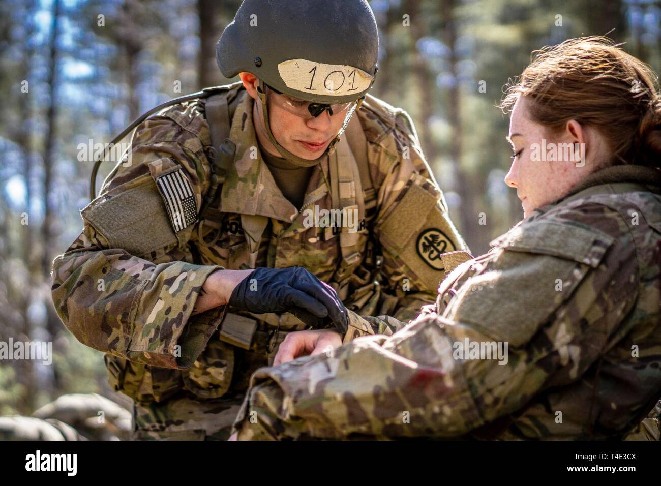 Spc. Alberto Acosta, 68W, assigned to the 173rd Airborne triages ...