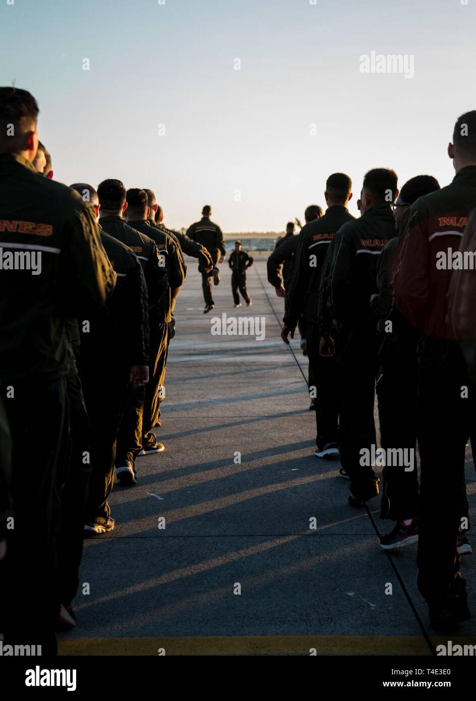 U.S. Marines perform stretches prior to conducting unit physical ...
