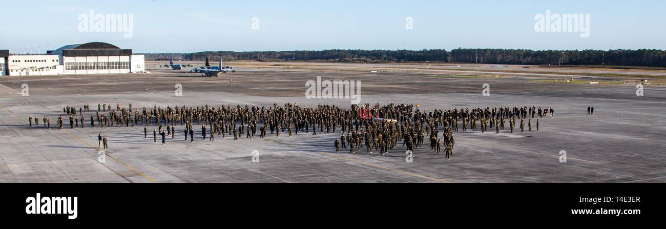 U.S. Marines conduct unit physical training on the flight line at ...