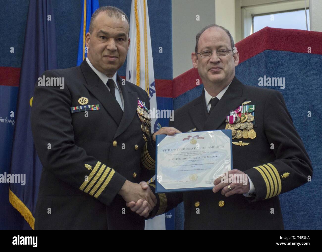 Fla. (March 27, 2019)—Capt. Dan Patterson, right, outgoing officer in ...