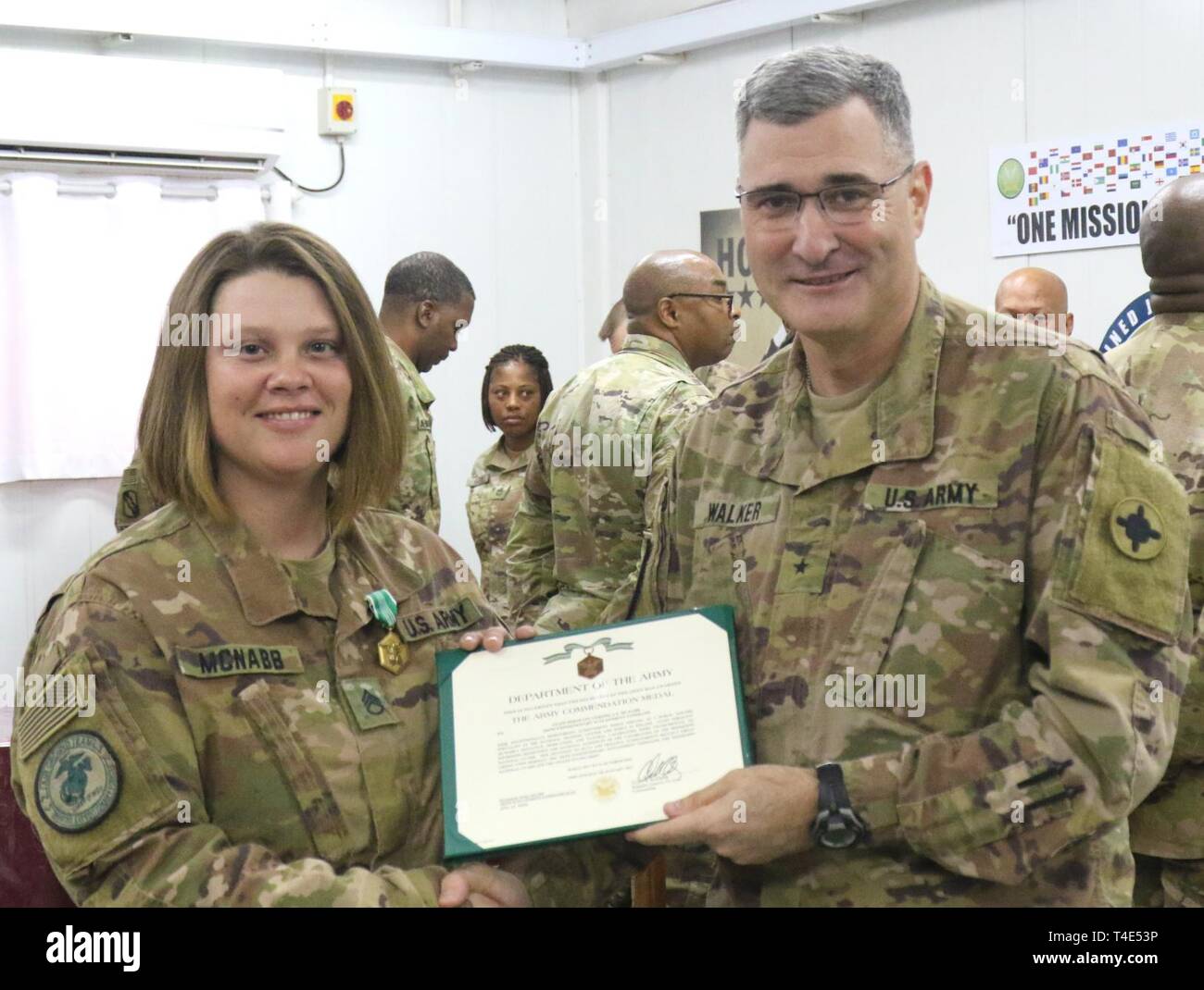 Staff Sgt. Veronica McNabb, 184th Sustainment Command, receives an Army ...