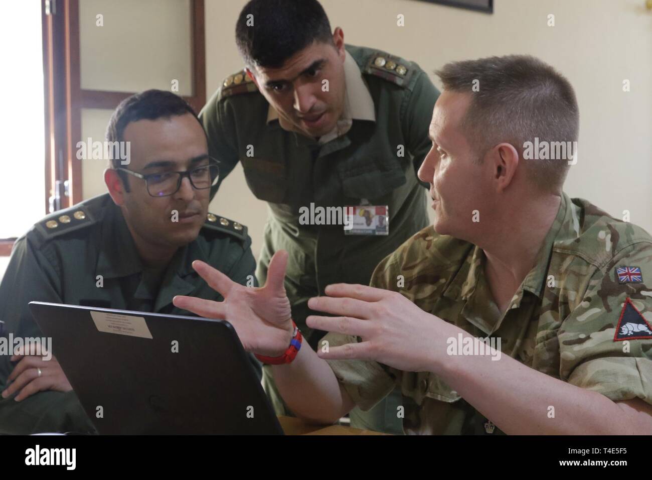 A U.K. soldier works alongside his Royal Moroccan Armed Forces ...