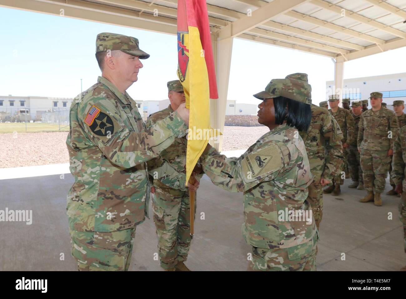 Capt. Chris Ingram, Headhunter commander, receives the company's guidon ...