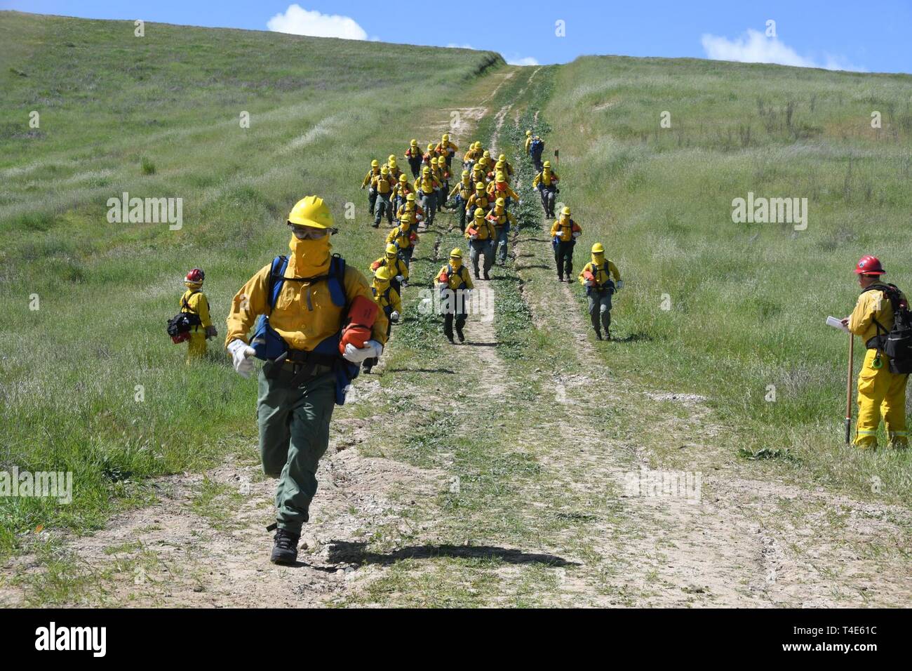 Cal Guard Soldiers from Task Force Rattlesnake run down a hill during ...